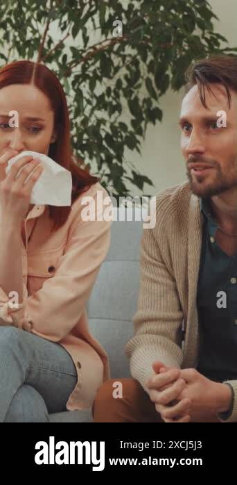 Vertical Screen: Visibly upset woman cries during therapy session ...