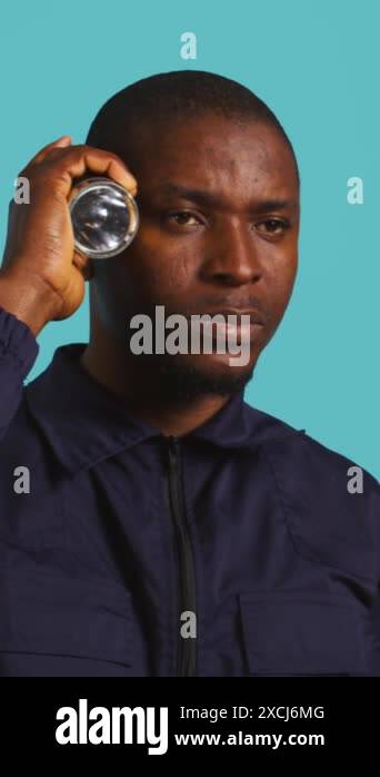 Vertical video Headshot portrait of security employee tasked with ...