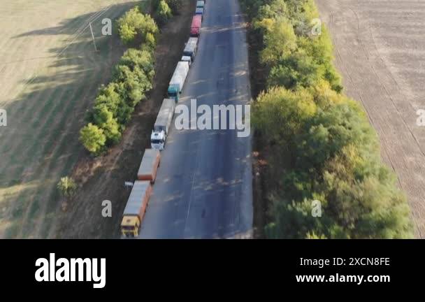 grain delivery. Aerial view. Grain storage. Grain trucks stand along ...