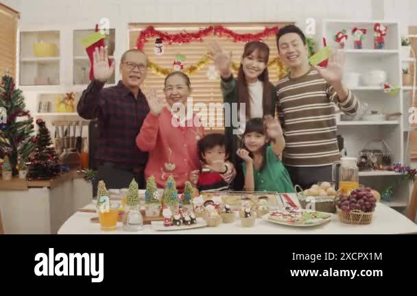 Asian Happy family spend times together to doing ginger breads and ...