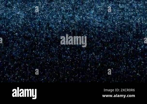 Tiny, glistening particles that resemble stars in a night sky create a ...