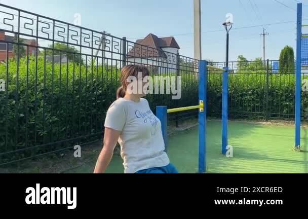 A dedicated young female athlete puts in the hard work, vigorously ...