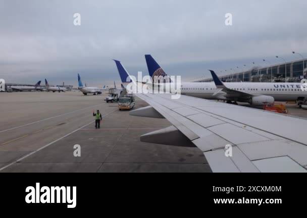 Wide view of AirPlane drive on runway in Chicago International Airport ...