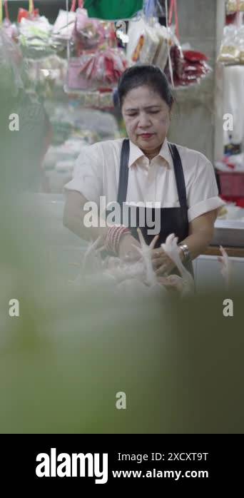 slow motion of a butcher at work removing the entrails and viscera of a ...