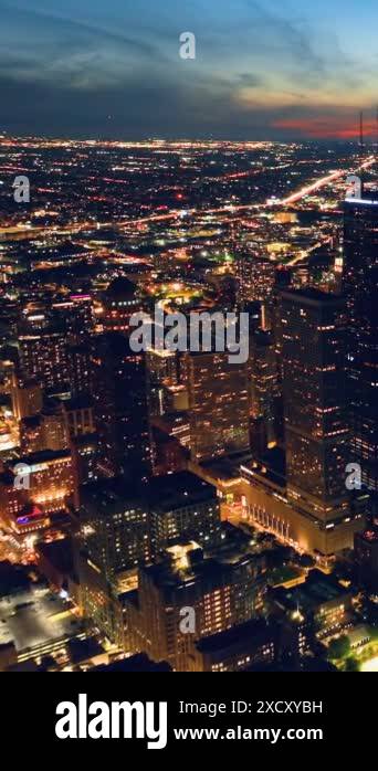 A picturesque glowing view of downtown Chicago at night. Blue sky with ...