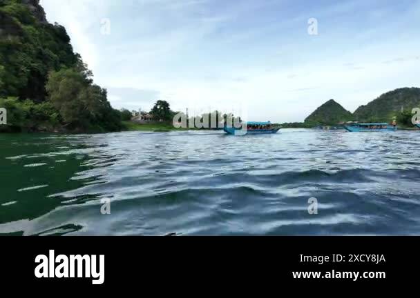 QUANG BINH, VIET NAM- JUNE 17, 2024: Boat transport group of traveler ...