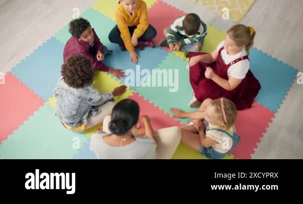 Kindergarten, children and hands with game in circle for development ...