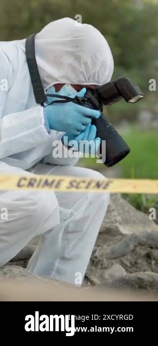 Crime scene, evidence and photographer with camera in woods with hazmat ...