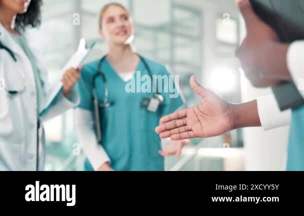 Nurse, doctor and shaking hands for healthcare meeting, support and ...