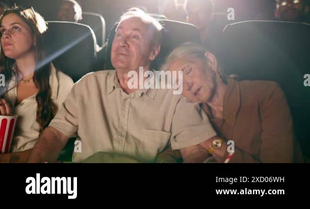 Movie, love and elderly couple in cinema with smile for comedy film ...