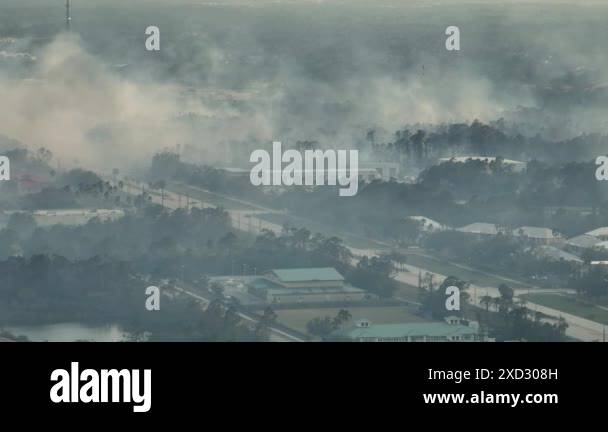 Aerial view of fire department helicopter extinguishing wildfire ...