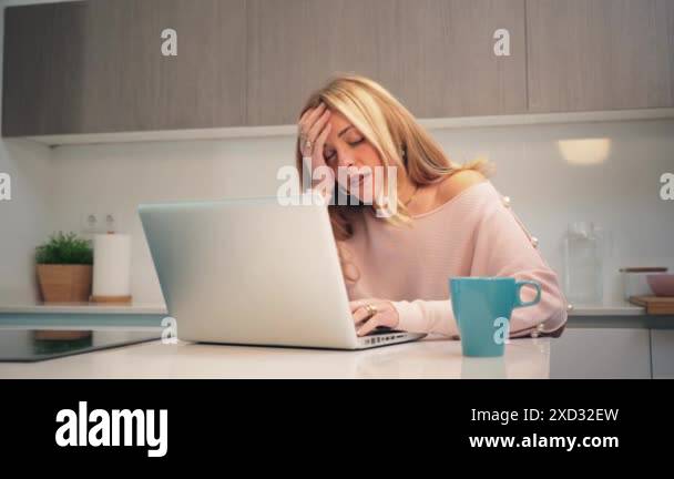 A hard working woman, desperate due to laptop issues causing her stress ...