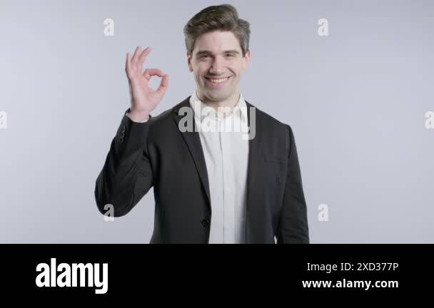 Positive mature 30s businessman makes OK, okay hand sign gesture. Happy ...