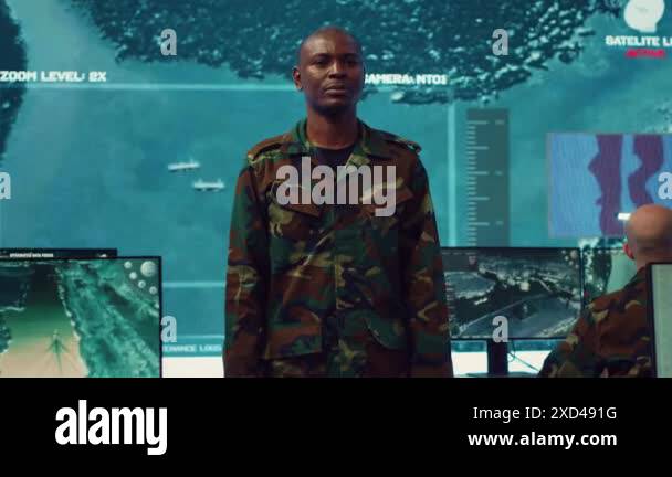 Standing at attention, the soldier executes the military salute gesture ...