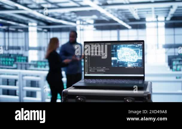 Laptop in data center facility with artificial intelligence computing simulating human brain ...