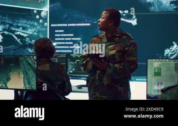 Woman sergeant major working on deployment of electronic warfare tools to disrupt enemy ...