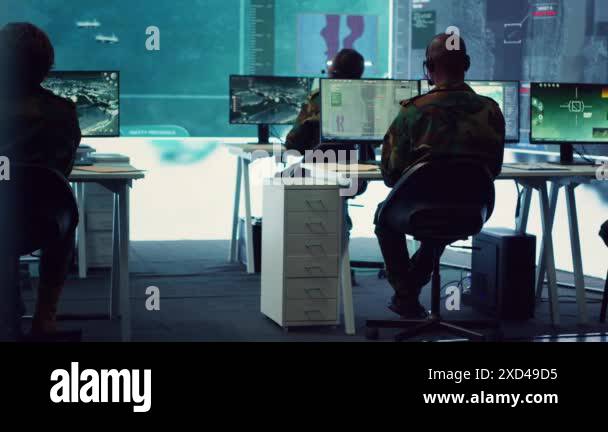 Military crew working in reconnaissance control tower power base ...