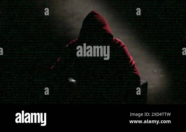 Anonymous man in a hood interview video footage. Mysterious man sitting ...