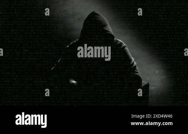 Anonymous man in a hood interview video footage. Mysterious man sitting ...