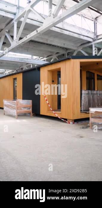 Prefabricated mobile wooden house at construction site. Newly built ...