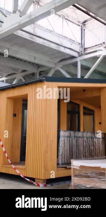 Prefabricated mobile wooden house at construction site. Newly built ...