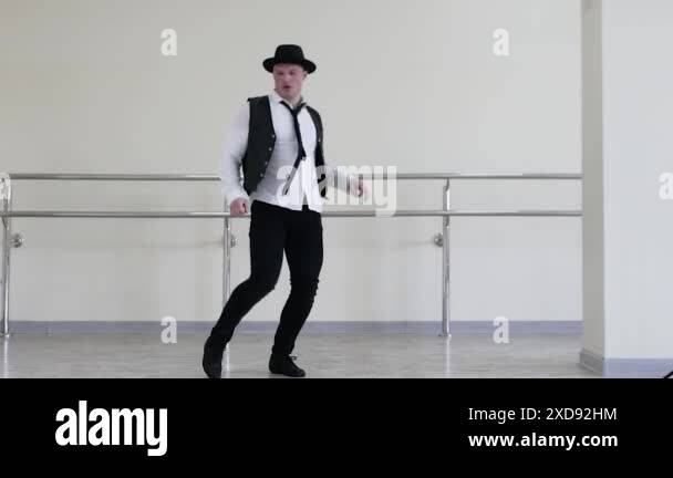 Soft focus. A gangster dances in a hat, a jazzman dances in a tie and ...