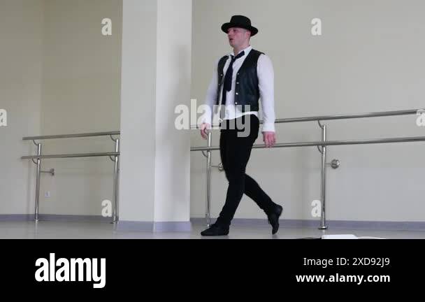 A gangster dances in a hat, a jazzman dances in a tie and vest ...