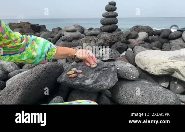 Woman placing chakra healing crystals. Witchcraft, herbal medicine and ...