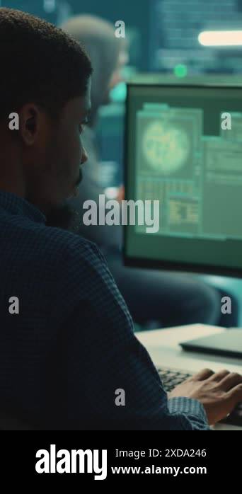 Vertical Video Cyber security team conducting cyber surveillance and threat detection in a ...