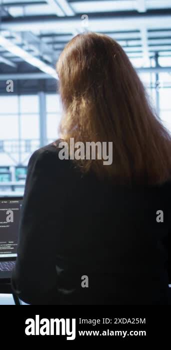 Vertical video Person in data center works with artificial intelligence ...