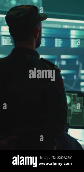 Vertical Video US military man supervising threat detection activity in ...