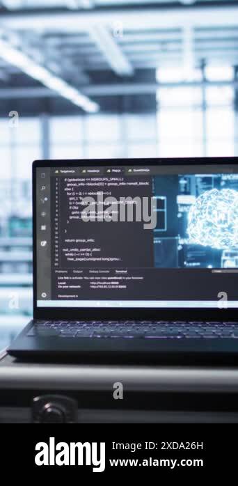 Vertical video Focus on laptop in data center with artificial intelligence brain used by ...