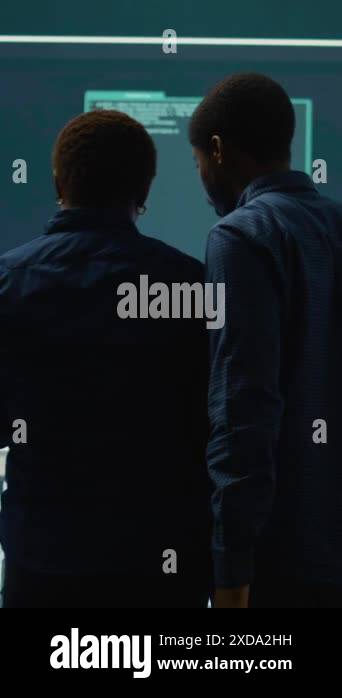 Vertical Video Cyber security team conducting cyber surveillance in a ...