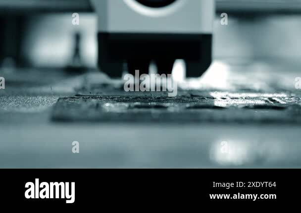 3D printer close up. A working 3D printer in process of printing object ...