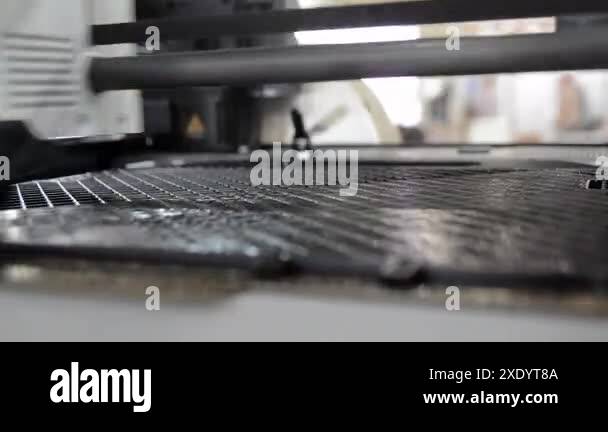3D printer close up. A working 3D printer in process of printing object ...
