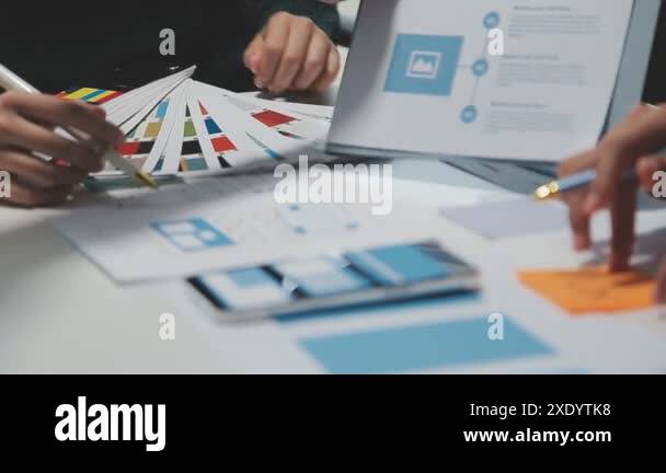 Design team collaborating on creating new app interface using prototype ...