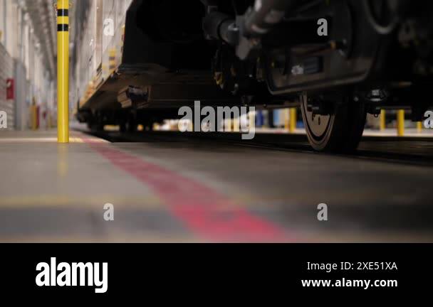 low angle, the train slowly departs from the station platform. Close-up ...