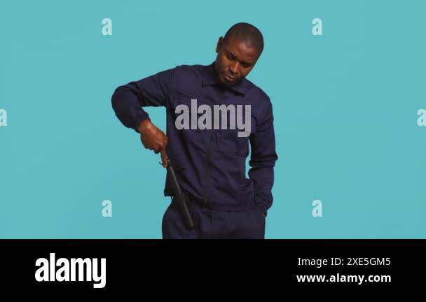 Security guard smacking hand with baton, intimidating suspects ...