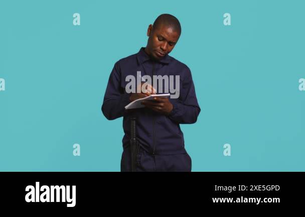 Security guard with notepad taking notes, receiving orders about ...