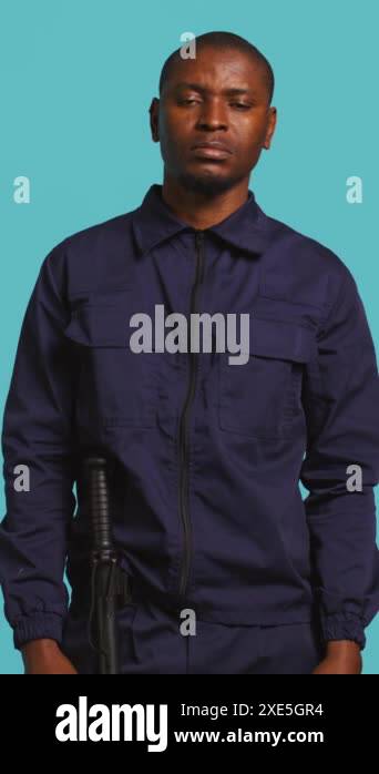 Vertical video Portrait of security job employee shooting gun ...