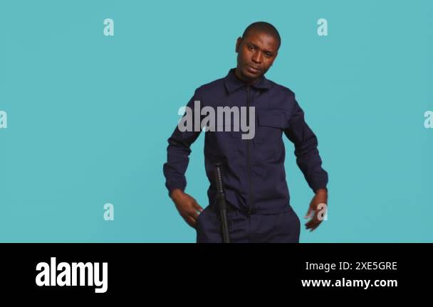 Security guard doing thumbs down sign gesturing, denying public access ...