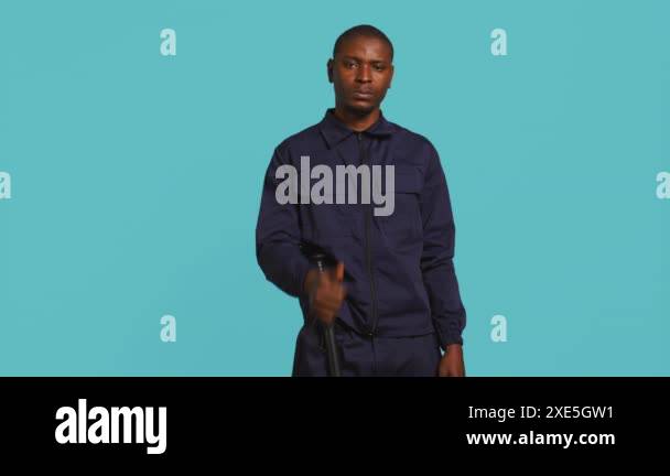 Happy security guard doing thumbs up sign gesturing with finger ...