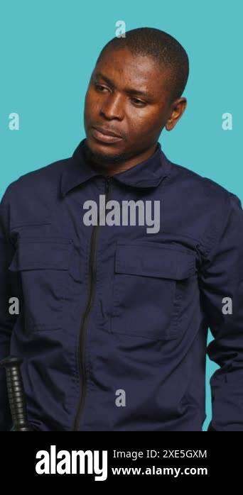 Vertical video Security guard preventing criminal activity turning on ...