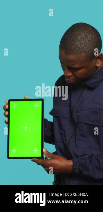 Vertical video Happy security guard working protection job presenting ...