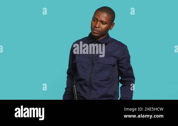 Security guard preventing criminal activity turning on flashlight after ...