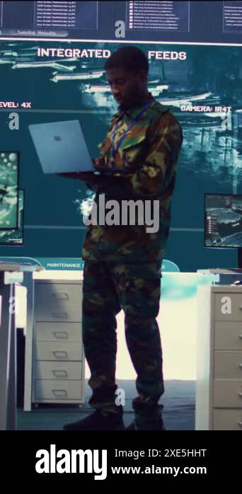 Vertical Video Military sergeant targeting enemy vessels on a gps ...