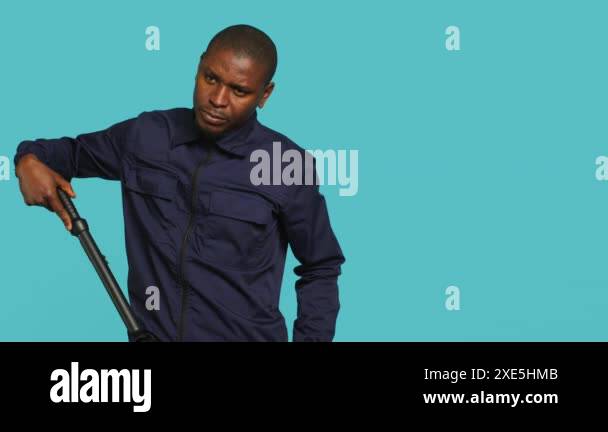 Security guard smacking hand with baton, intimidating suspects ...