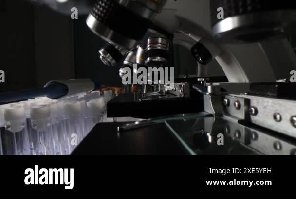 Modern microscopes and glass test tubes with corks. Laboratory ...