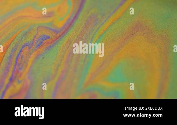 Shiny paint spill. Liquid marble. Blur orange purple turquoise color ...