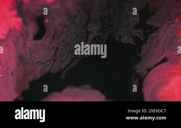 Shiny ink spill. Paint liquid. Blur black red color sparkling glitter ...